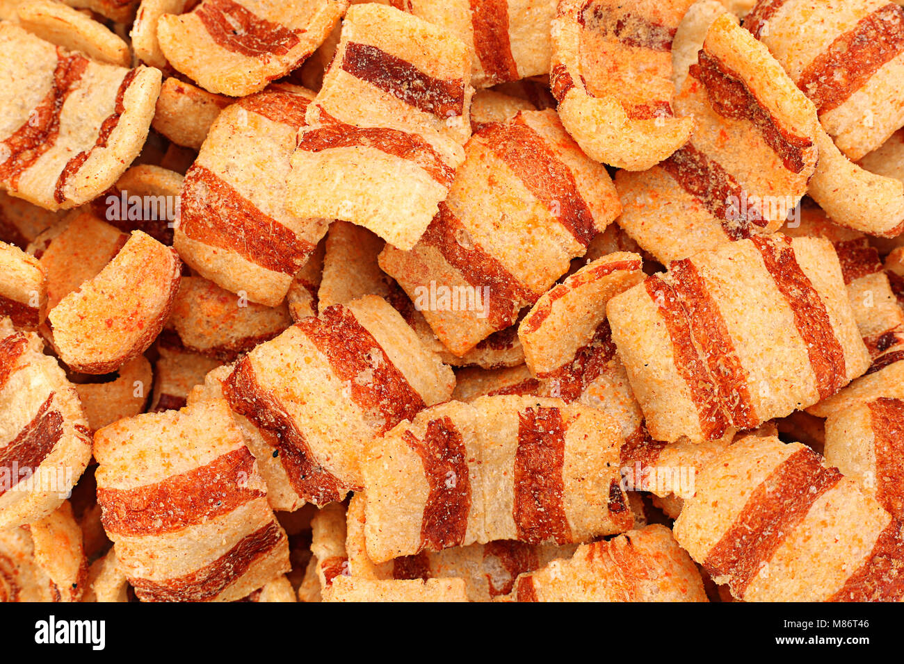 Pelleted salted snack bacon closeup detail background Stock Photo - Alamy