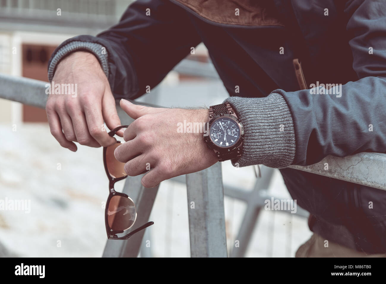 Luxury men’s watch and fancy sunglasses in man hands Stock Photo - Alamy
