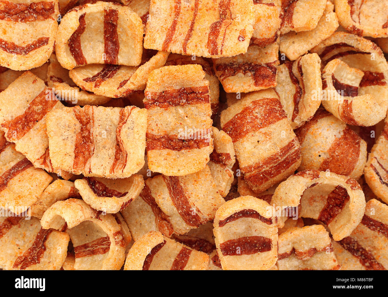 Pelleted salted snack bacon closeup detail background Stock Photo - Alamy