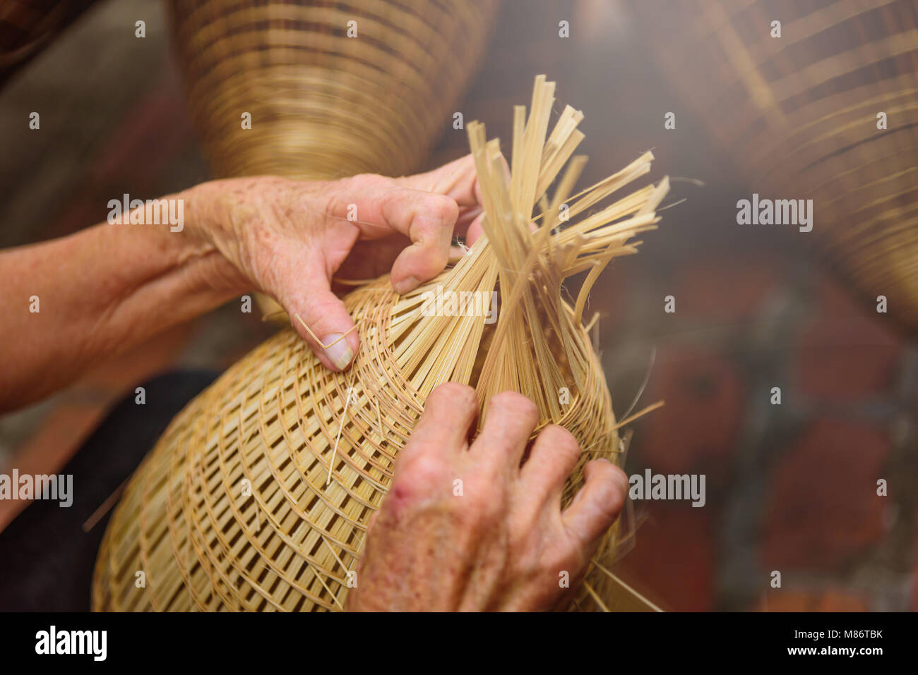 Vietnamese fishermen are doing basketry for fishing equipment at ...