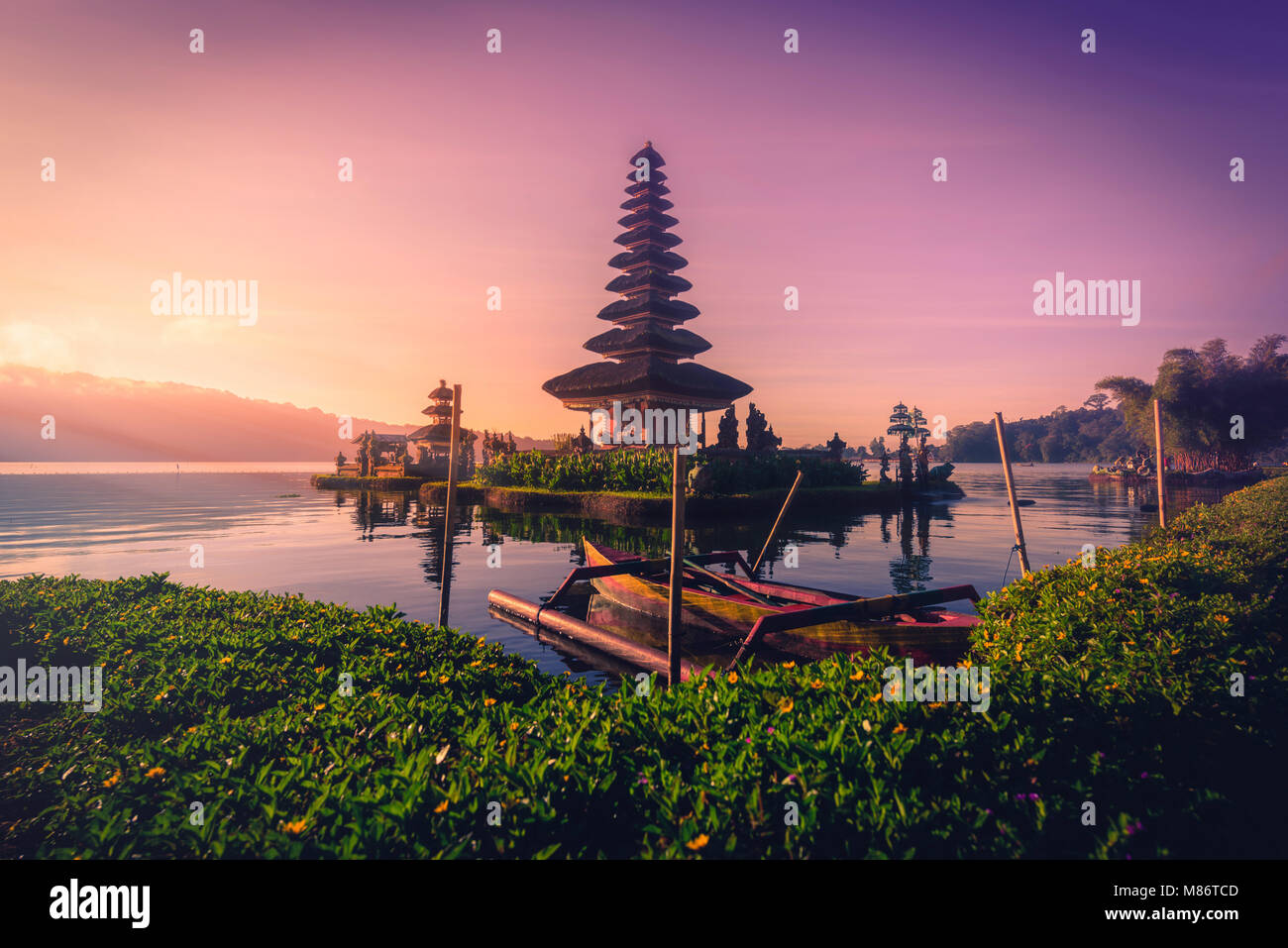 Pura Ulun Danu Bratan, Hindu temple with boat on Bratan lake landscape at sunrise in Bali ...