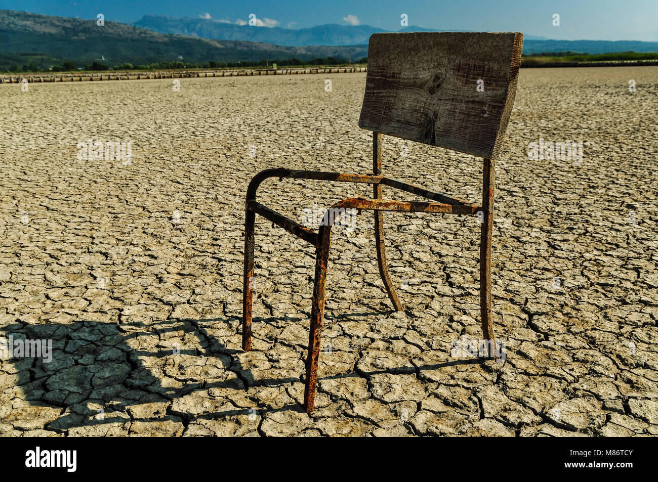 old chair on Dried up soil, drought Stock Photo - Alamy