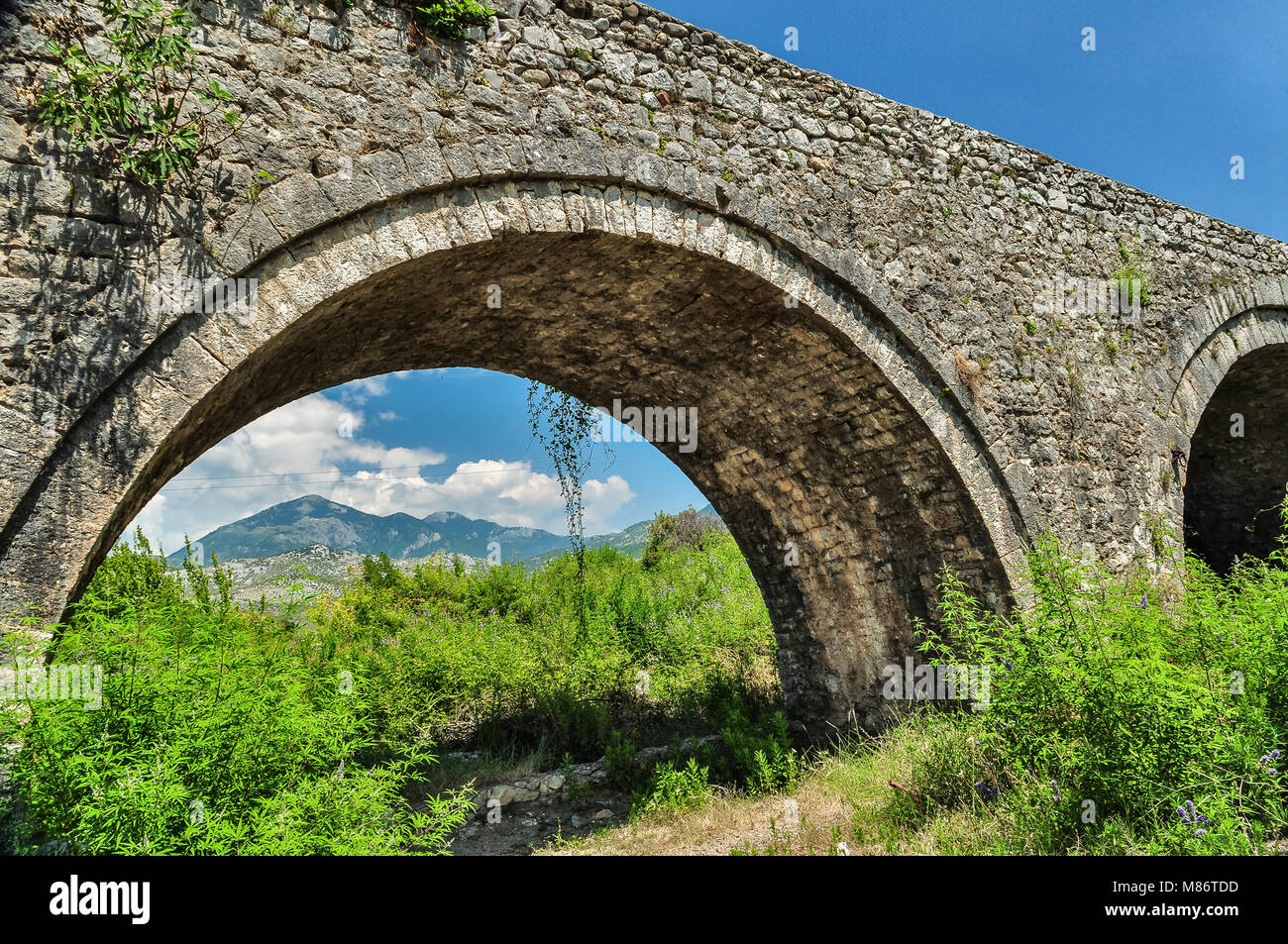 the Mesi bridge in Mes, near Shkoder. An old stone bridge built by the ...