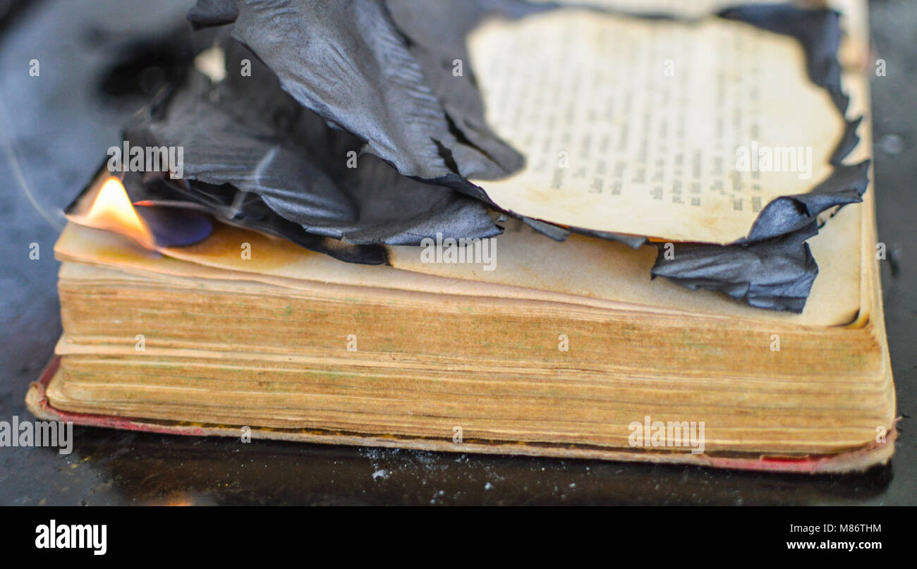 Burning old book Stock Photo - Alamy