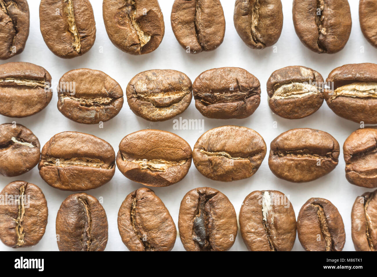 Horizontal and vertical rows of coffee beans.Different shapes and ...