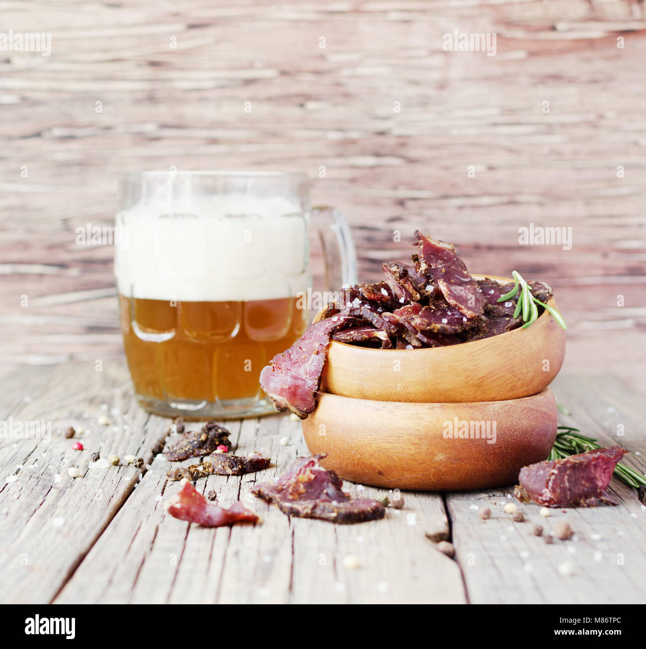 jerked dried meat, cow, deer, wild beast or biltong in wooden bowls on ...