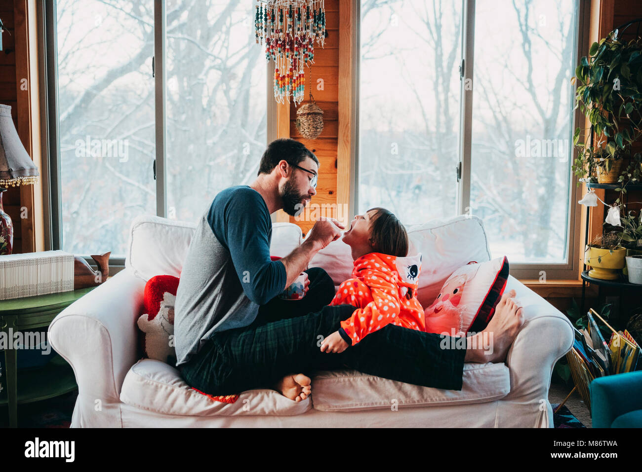 Father checking his daughter's teeth Stock Photo - Alamy