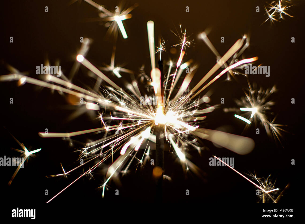 Burning sparkler in night Stock Photo - Alamy