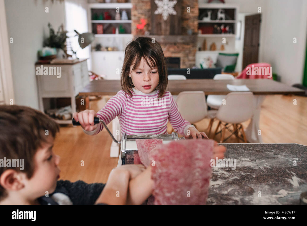 Boy and girl making pasta Stock Photo - Alamy