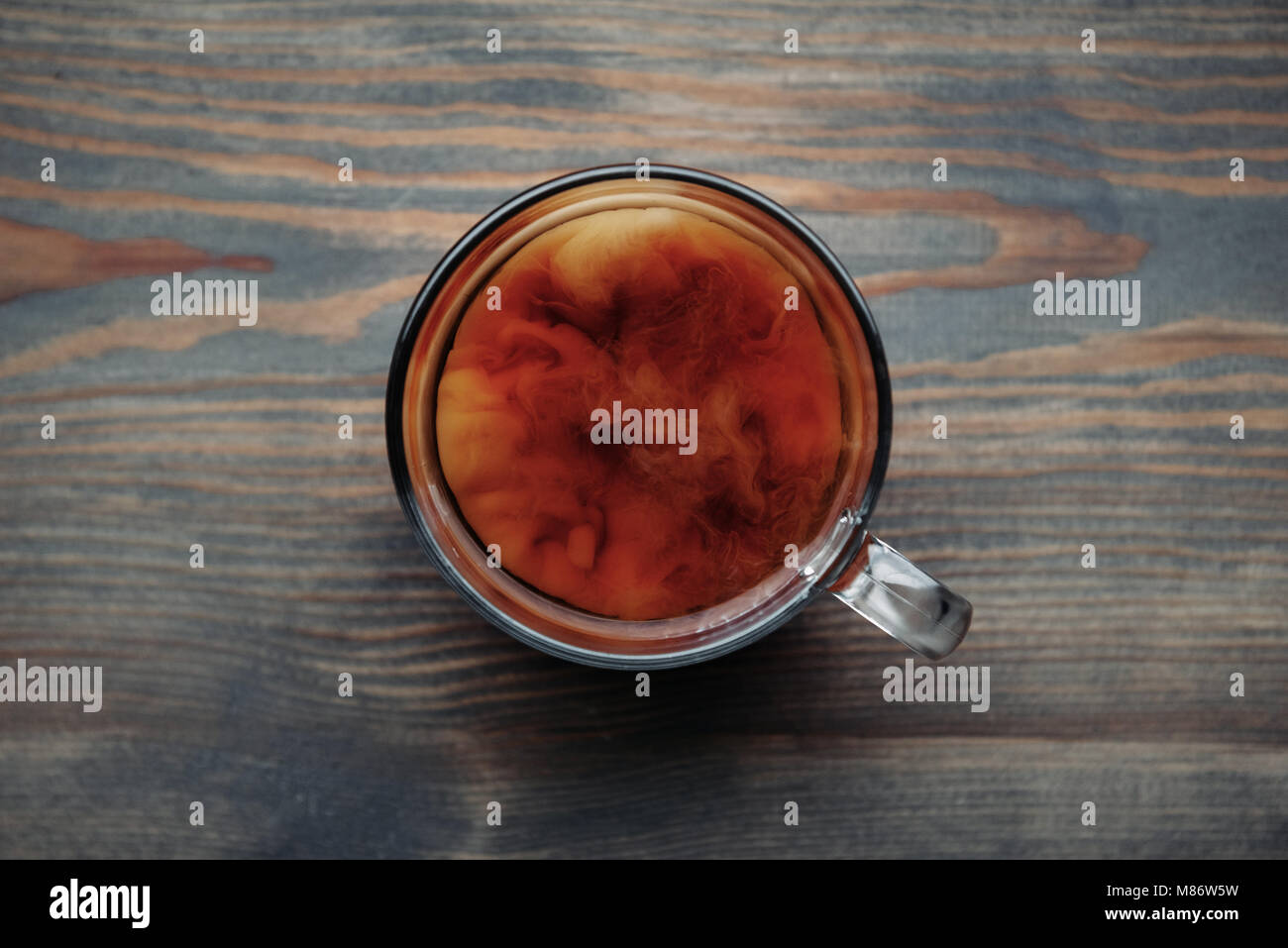 Overhead view of a cup of milky tea Stock Photo - Alamy