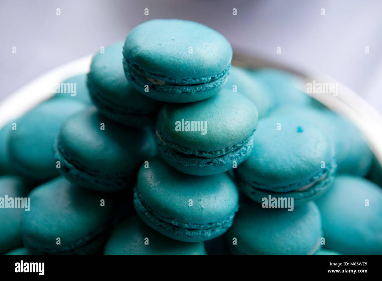 Close-up of a stack of blue macaroons Stock Photo - Alamy
