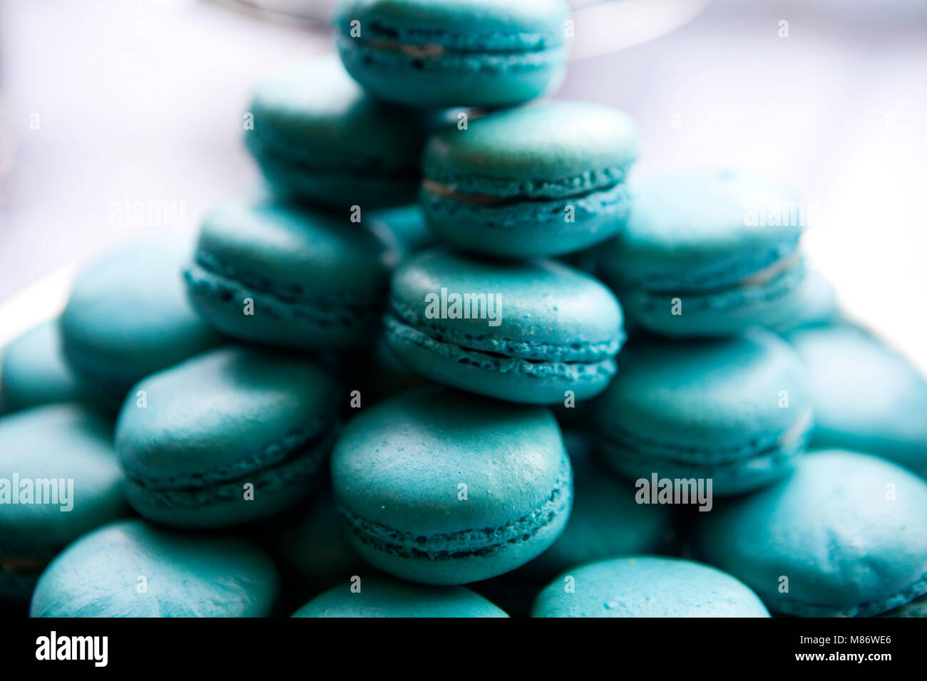 Close-up of a stack of blue macaroons Stock Photo - Alamy