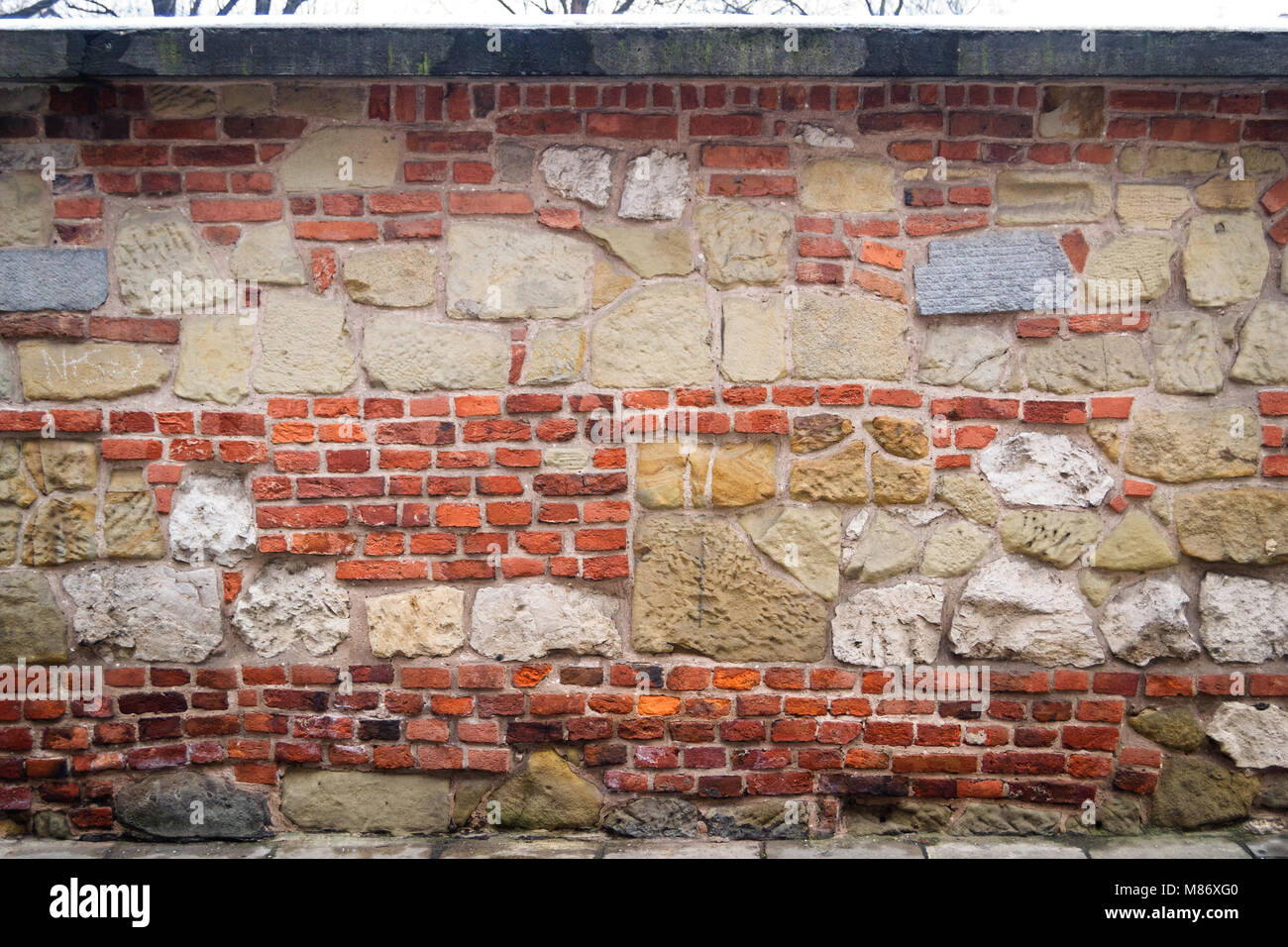 Wall made of different shaped bricks Stock Photo - Alamy