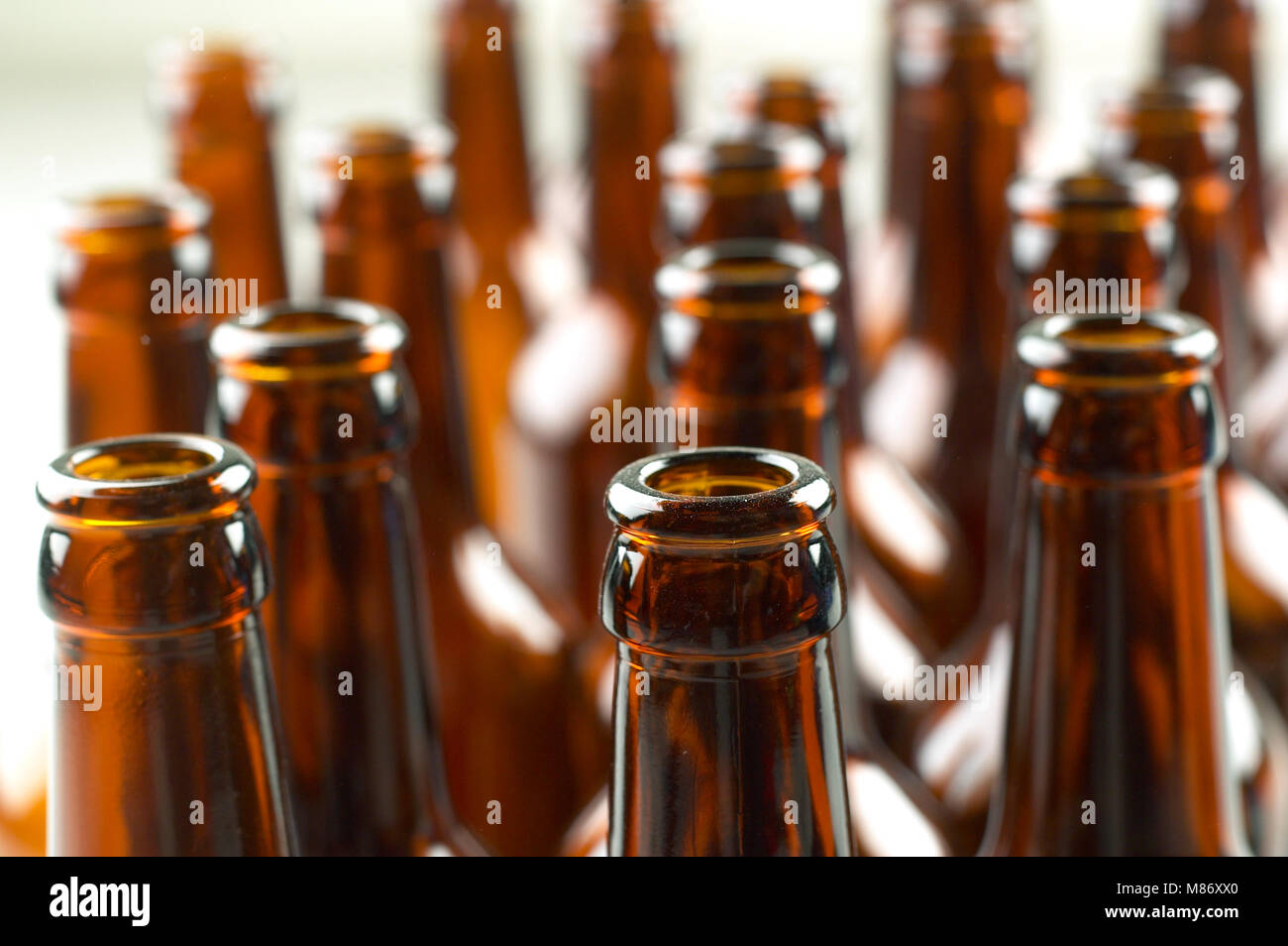 brown glass-bottles at an assembly line Stock Photo - Alamy