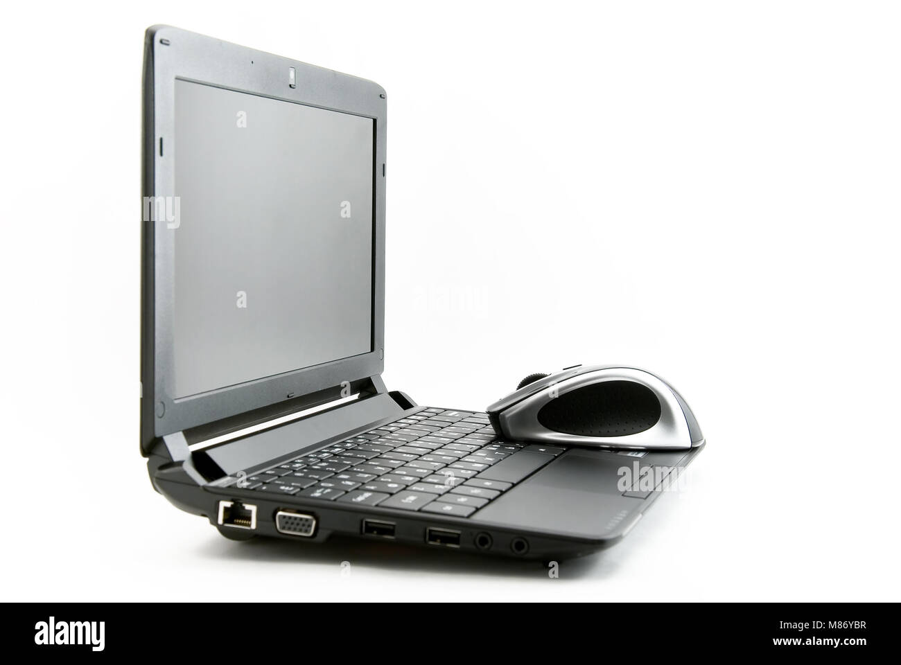 Wireless mouse lies on the closed laptop Stock Photo - Alamy