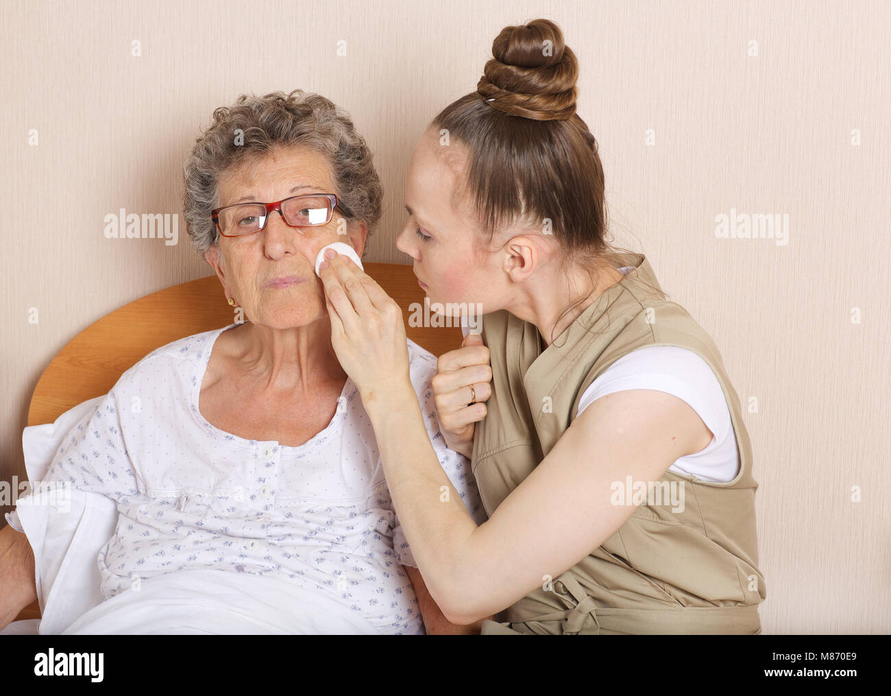 Young social work assistant takes care of a senior woman Stock Photo ...