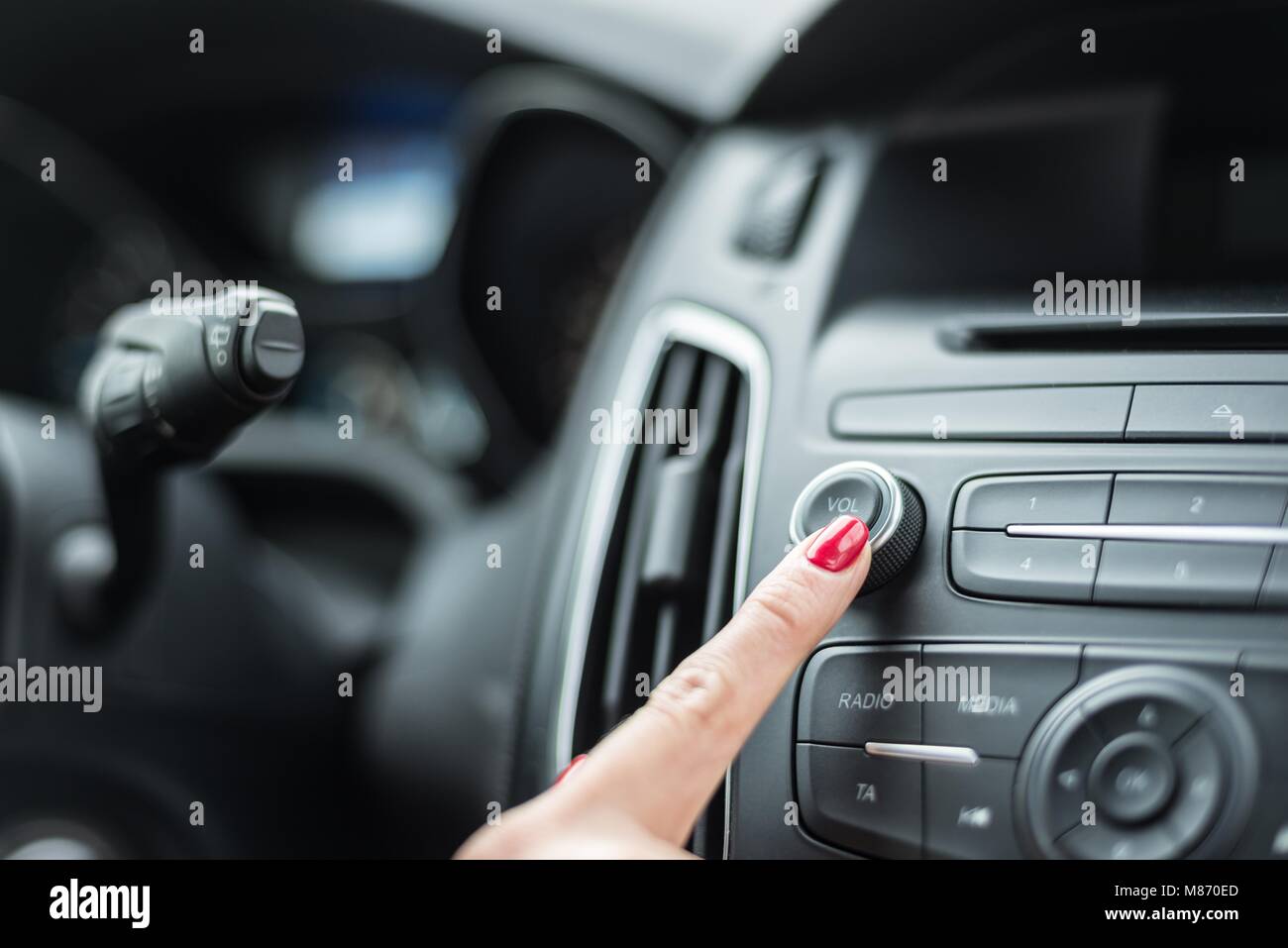 Woman turning on radio hi-res stock photography and images - Alamy