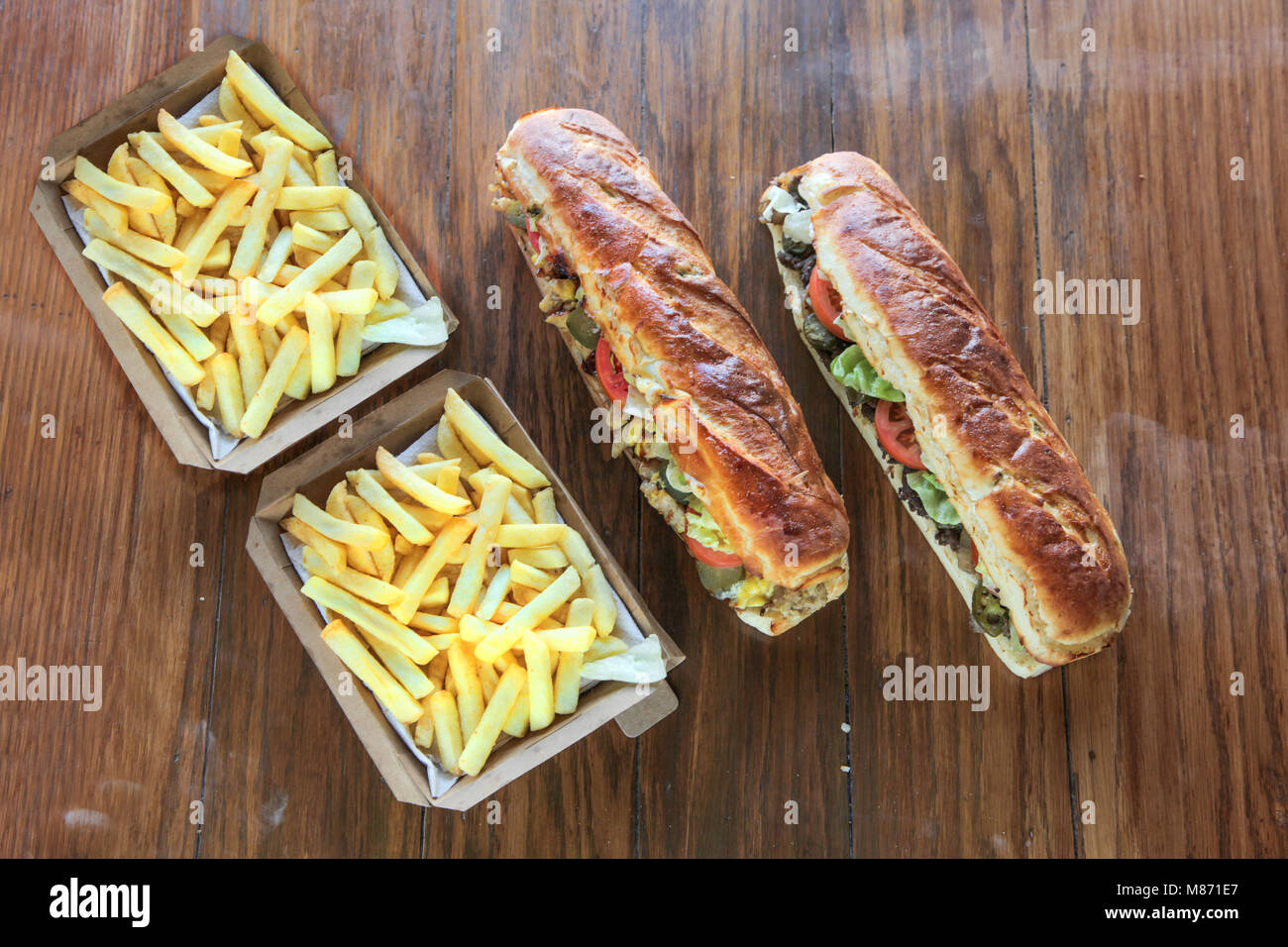 Extra large mighty sandwiches with box of potato french fries meal for ...