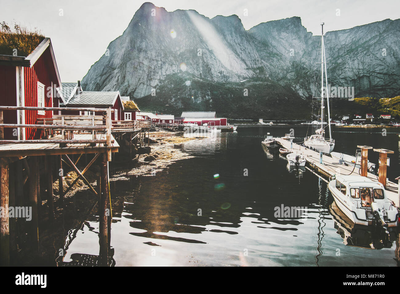 Reine village in Norway traditional rorbu red houses at sea and rocky ...