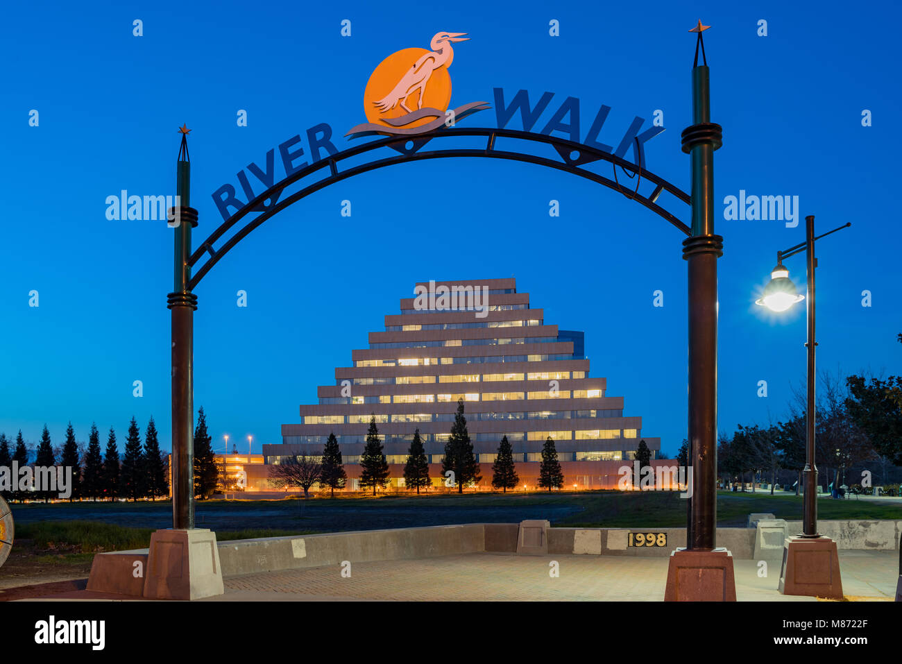 Night view of the entrance of River Walk with The Ziggurat as ...