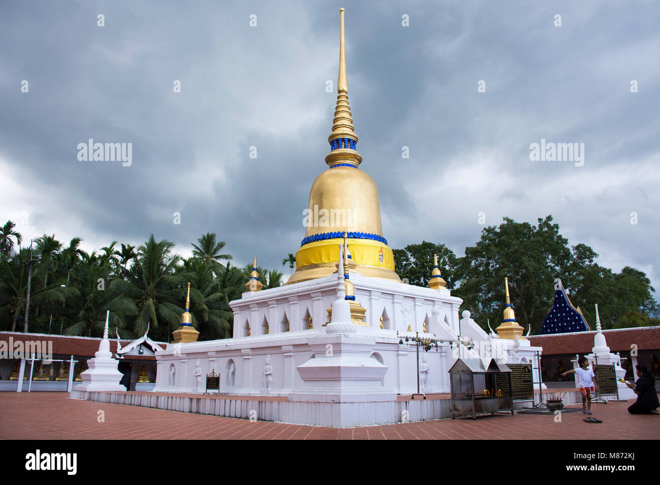 Thai people and foreigner travelers visit with praying golden chedi and ...