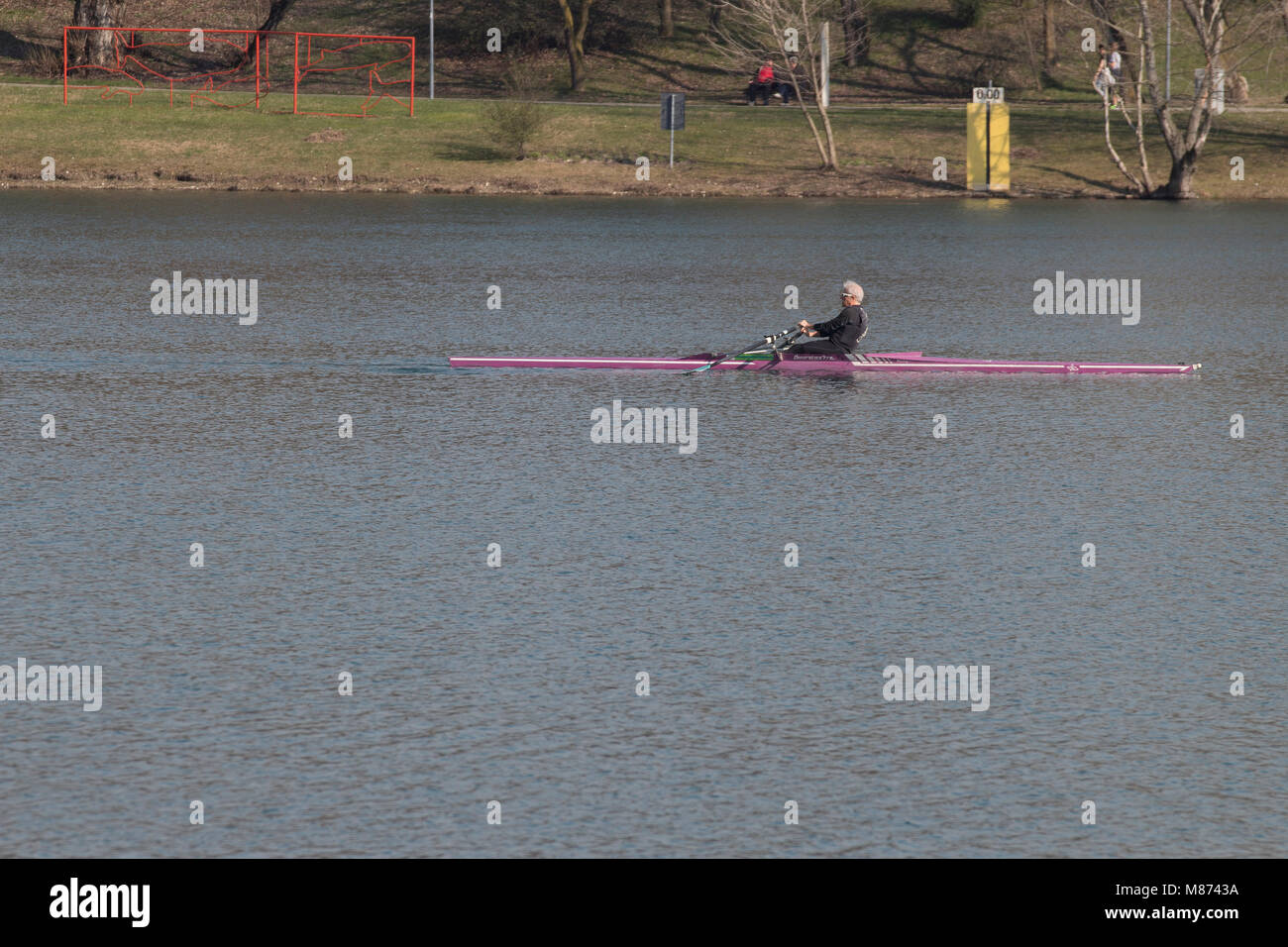 a beautiful lake with a person boating Stock Photo - Alamy