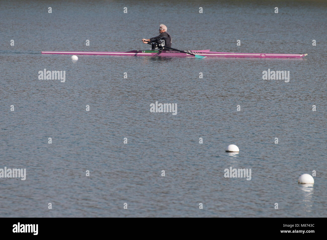 a beautiful lake with a person boating Stock Photo - Alamy