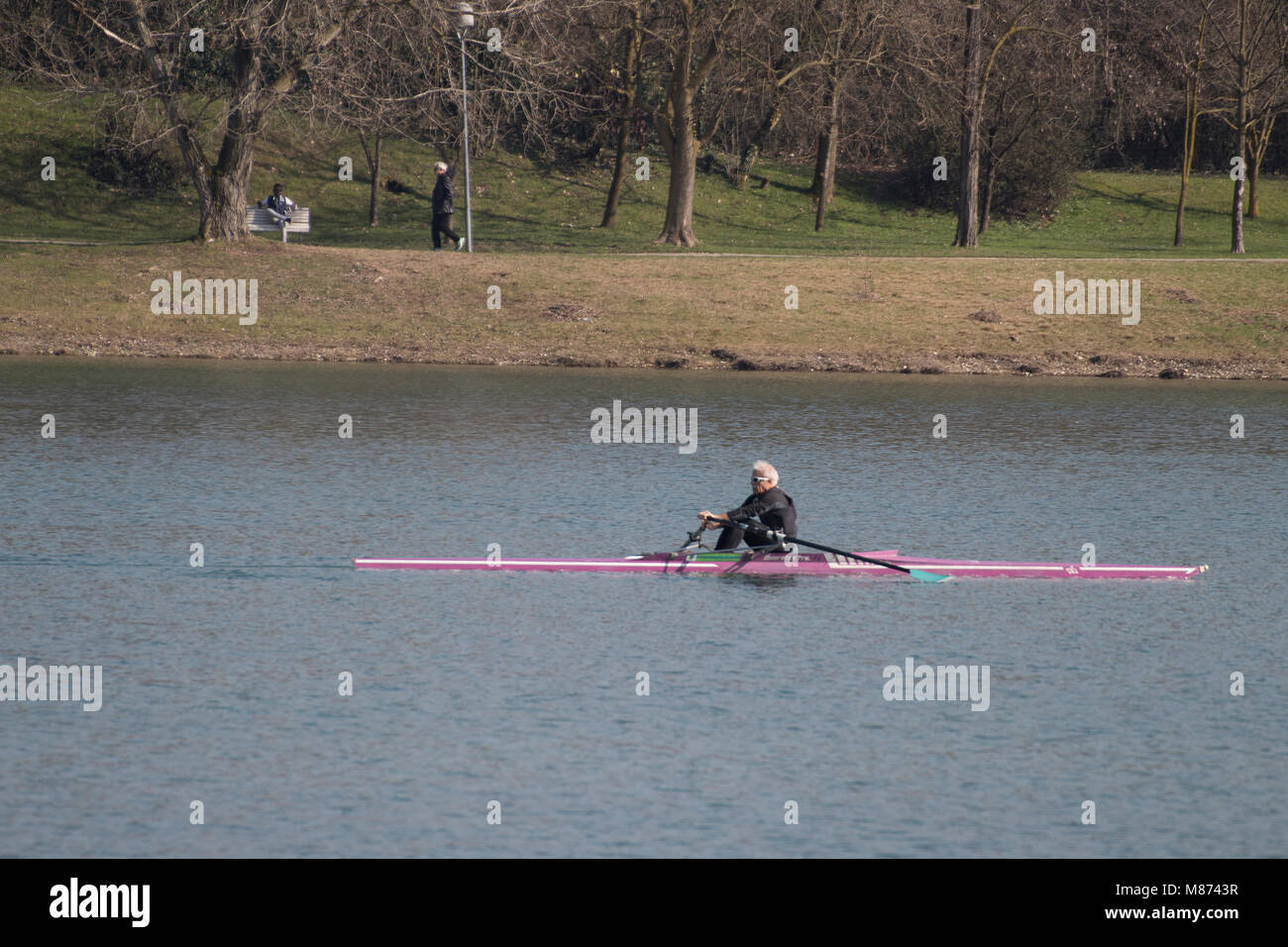a beautiful lake with a person boating Stock Photo - Alamy