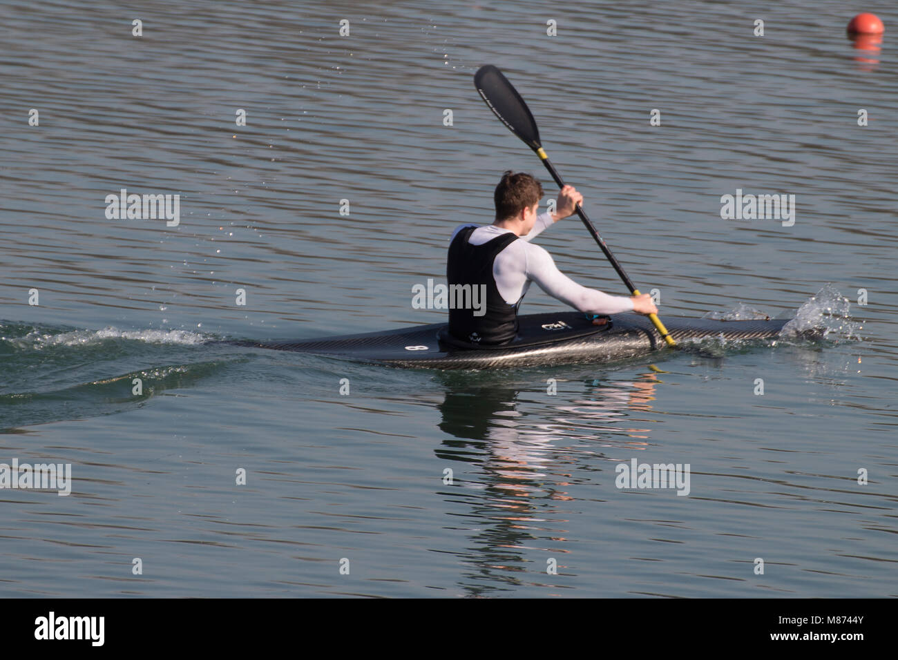 a beautiful lake with a man boating Stock Photo - Alamy