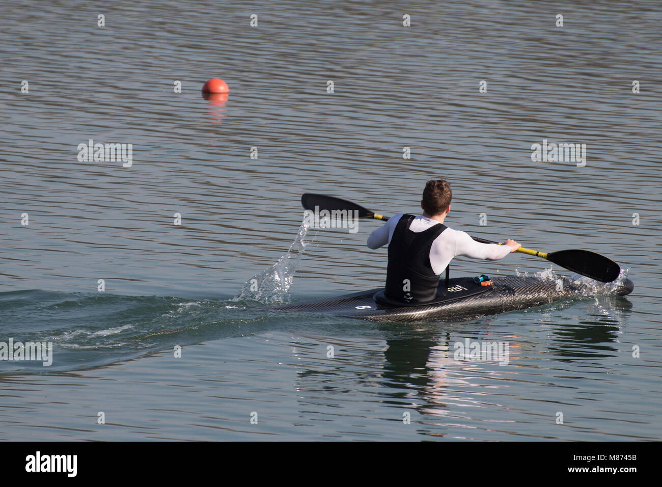 a beautiful lake with a man boating Stock Photo - Alamy