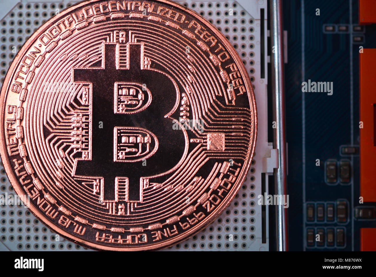 Bitcoin digital currency, bit-coin on motherboard or electronic board ...