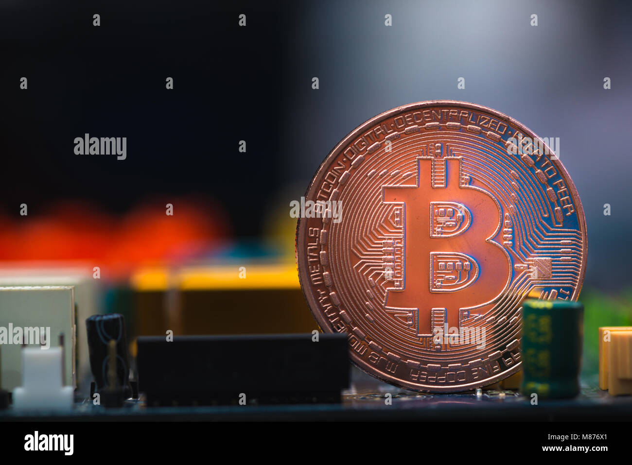 Bitcoin digital currency, bit-coin on motherboard or electronic board ...