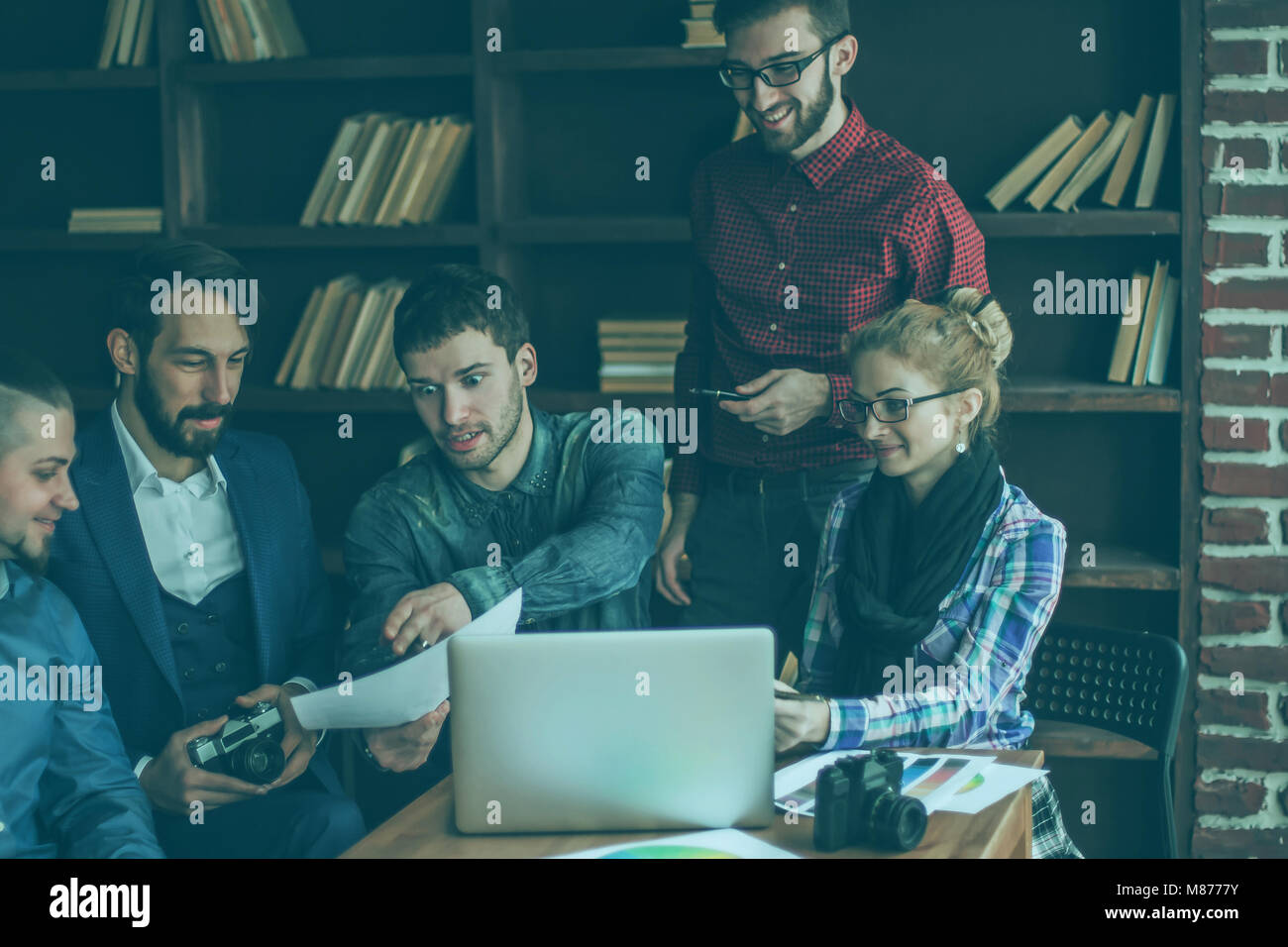 friendly team of copywriters in the workplace in modern office Stock ...