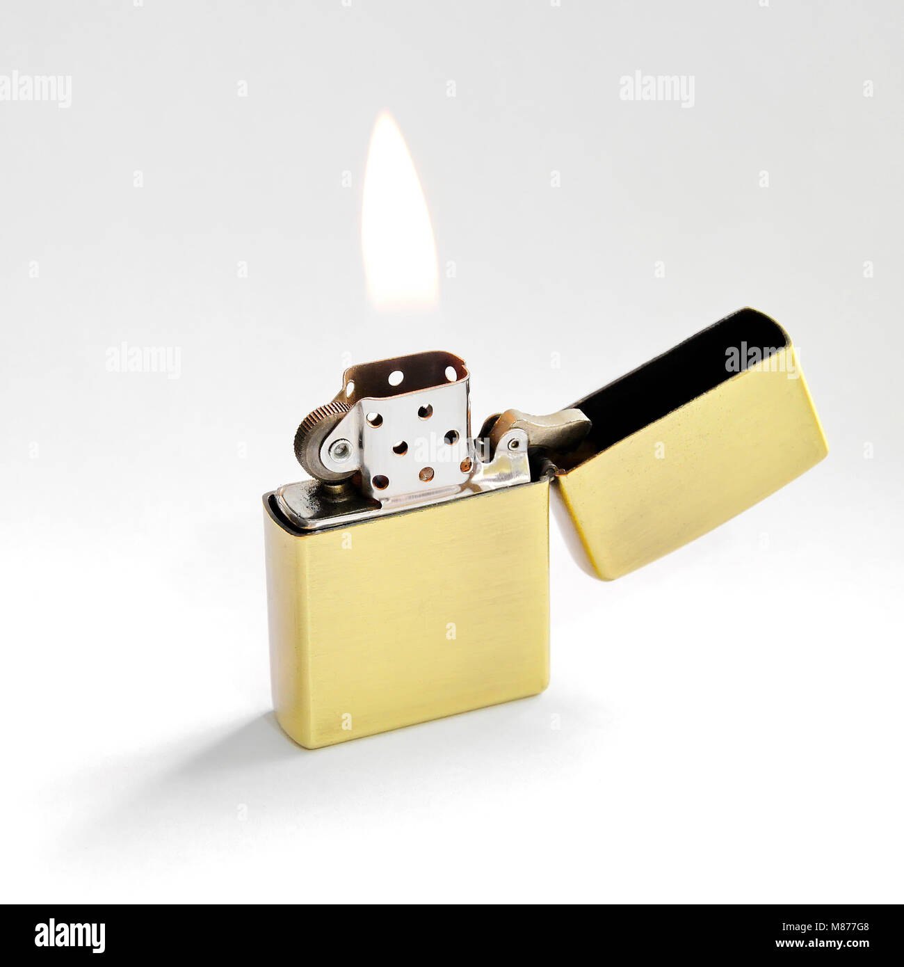 Closed lp lighter with flame Isolated on white Background Stock Photo ...