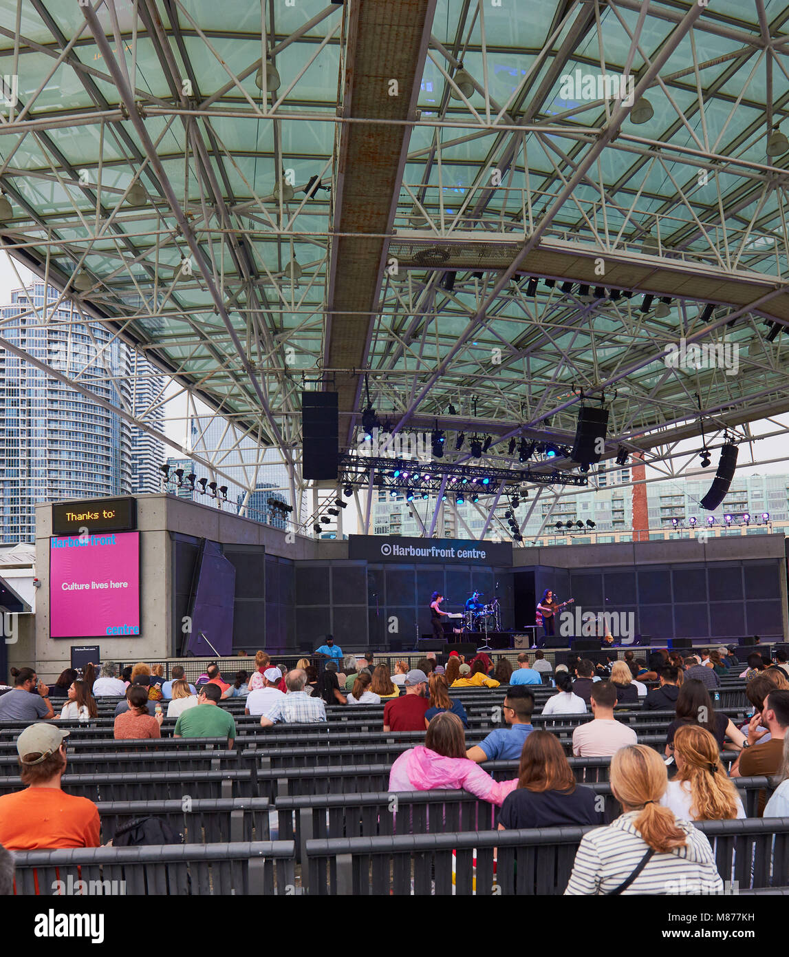 Audience listening to live music at the Harbourfront Centre, Toronto ...
