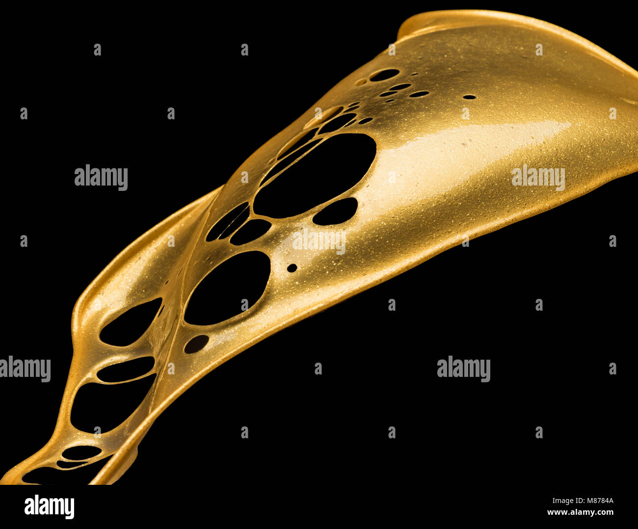 splendid golden splash over black background Stock Photo - Alamy