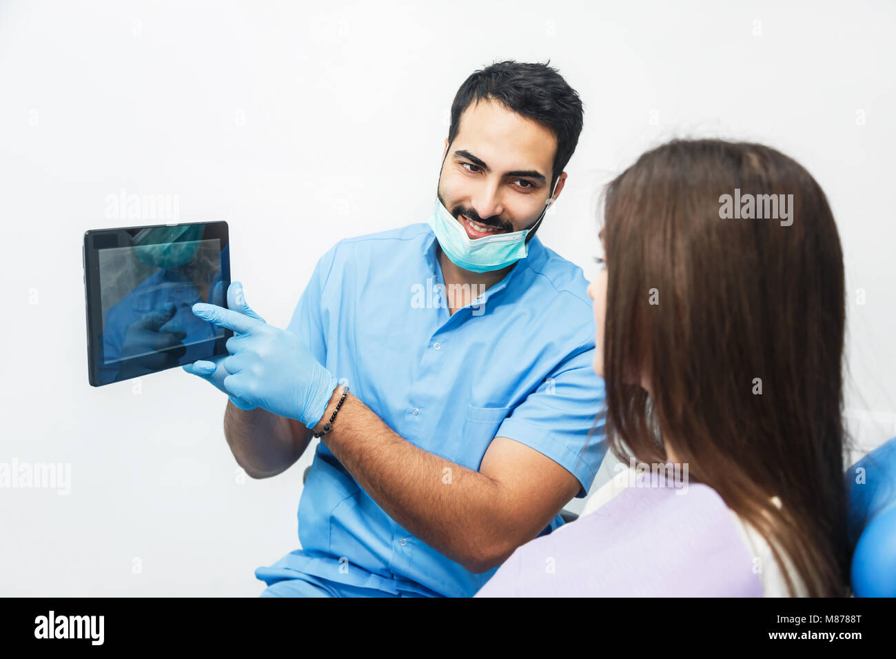 Doctor Shows Teeth X-ray on Tablet Stock Photo - Alamy