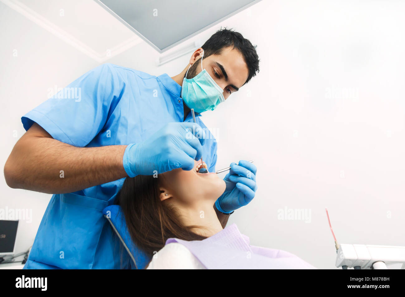 Dentist work examines patient hi-res stock photography and images - Alamy