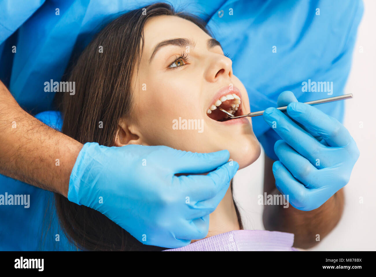 Dentist work examines patient hi-res stock photography and images - Alamy