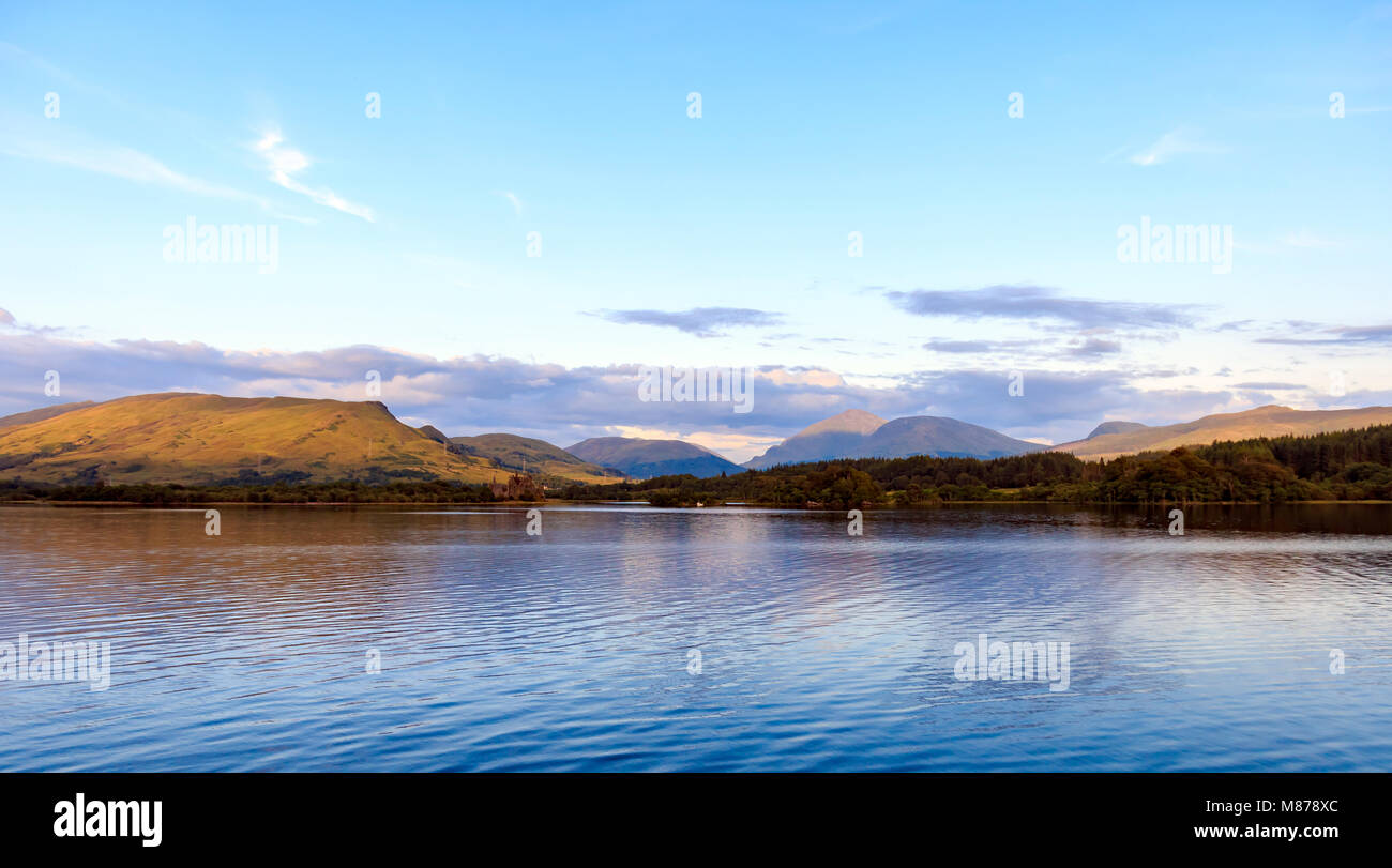 View over Loch Awe Scotland with the late evening sun lighting the ...