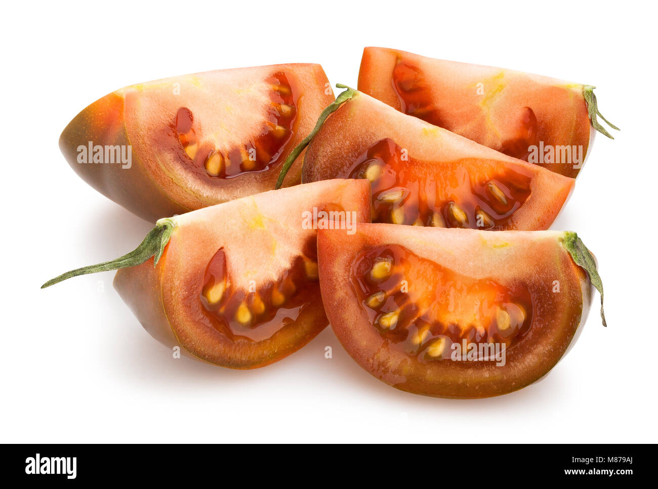 sliced kumato tomato path isolated Stock Photo - Alamy