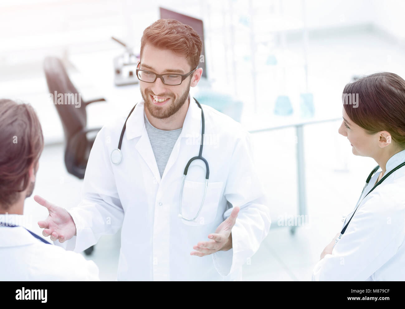 Group of doctors talking Stock Photo - Alamy