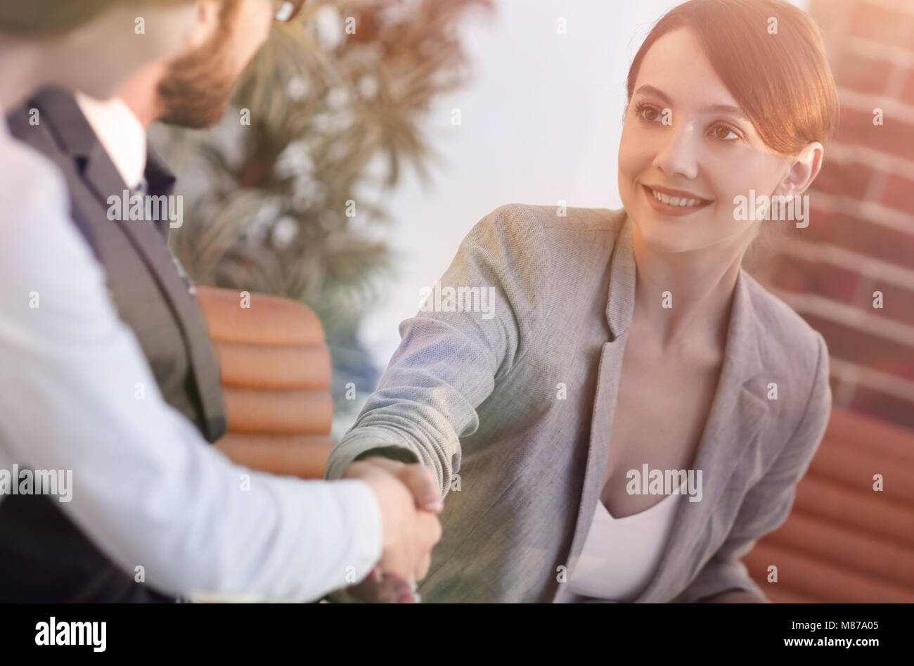 business woman greets the employee with a handshake Stock Photo - Alamy