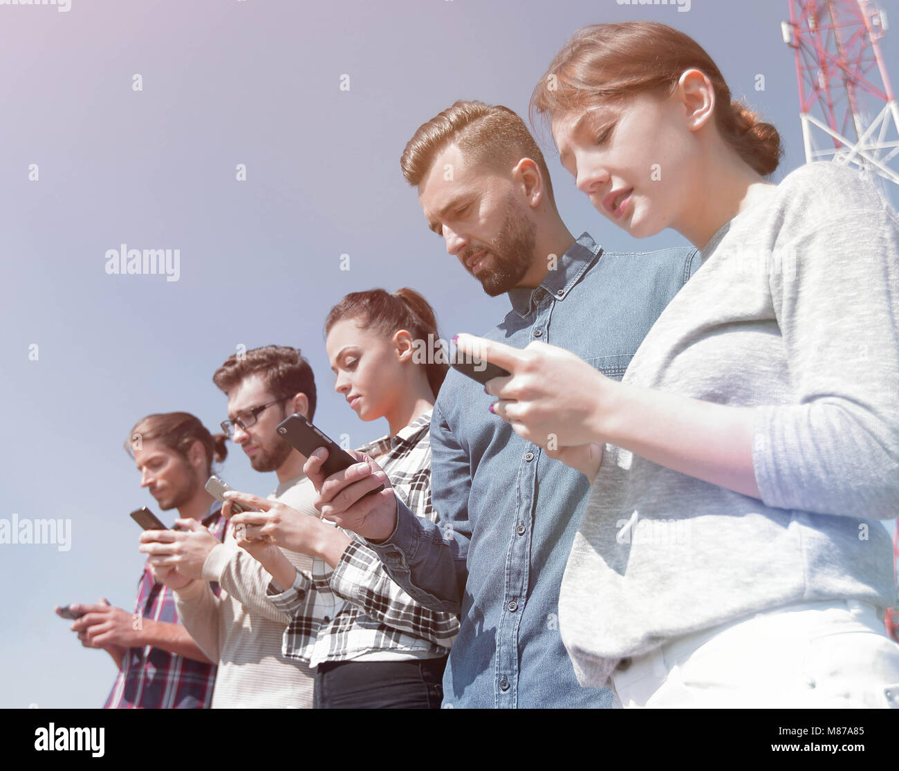 young people using smartphones to search network Stock Photo - Alamy