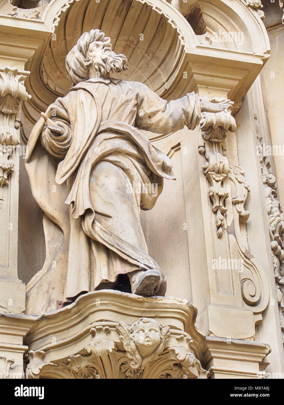 Statue of old-aged bearded man on the facade of The Basilica of Saint ...