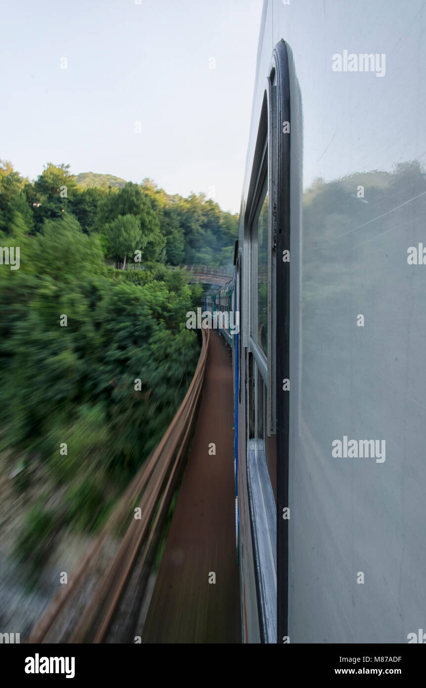 View of a train through a bridge Stock Photo - Alamy
