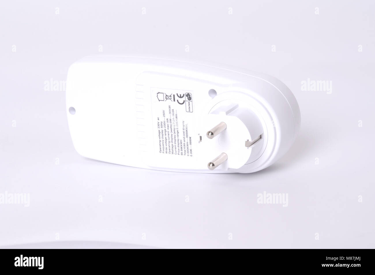 Watt Meter Plug in Operation on an Electrical Socket on the Wall Stock ...