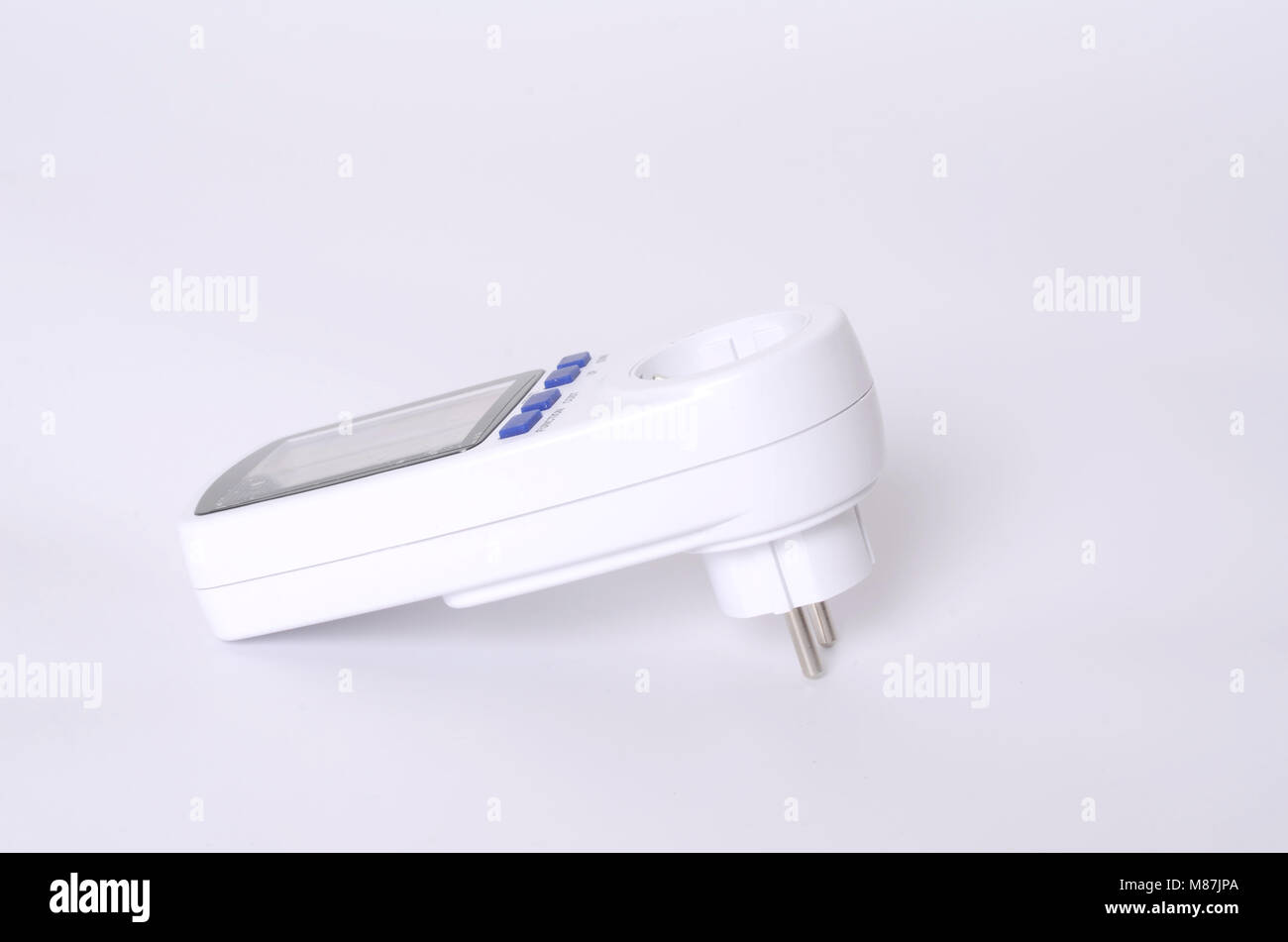 Watt Meter Plug in Operation on an Electrical Socket on the Wall Stock ...