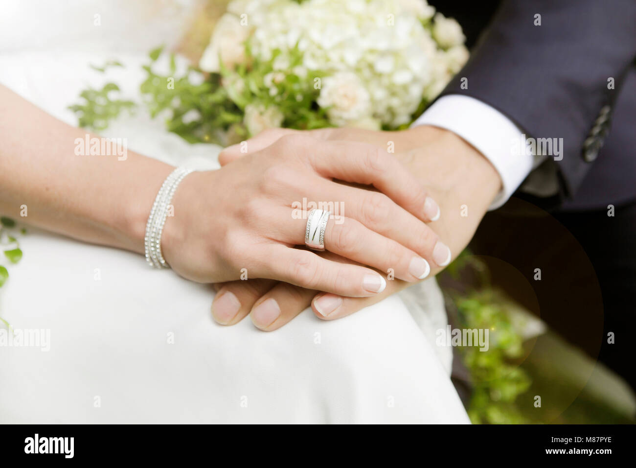 a newlyweds keep their hands together with the new wedding rings Stock ...