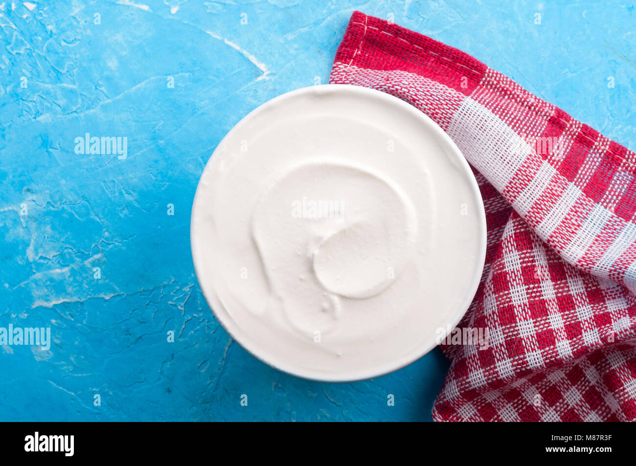 Yogurt on blue background. Dairy product. Healthy food and diet concept ...